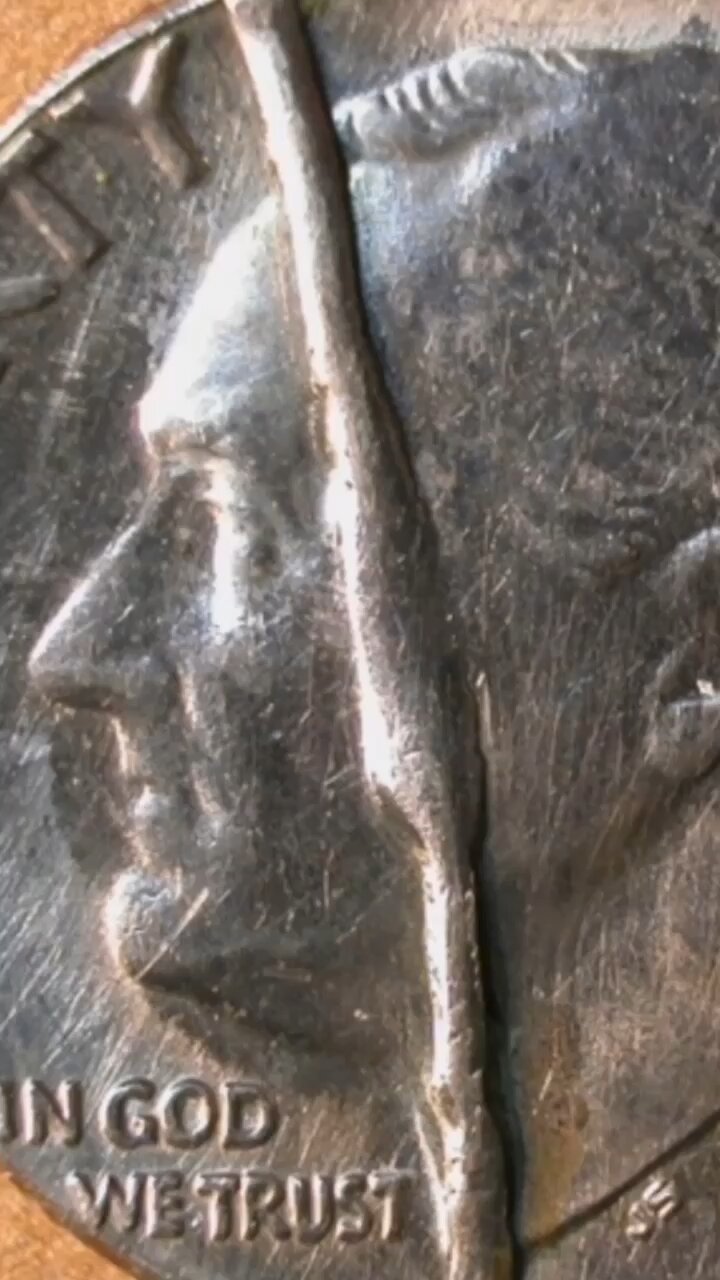 Understanding Cuds: How Die Breaks Create Flat Blobs on Coins