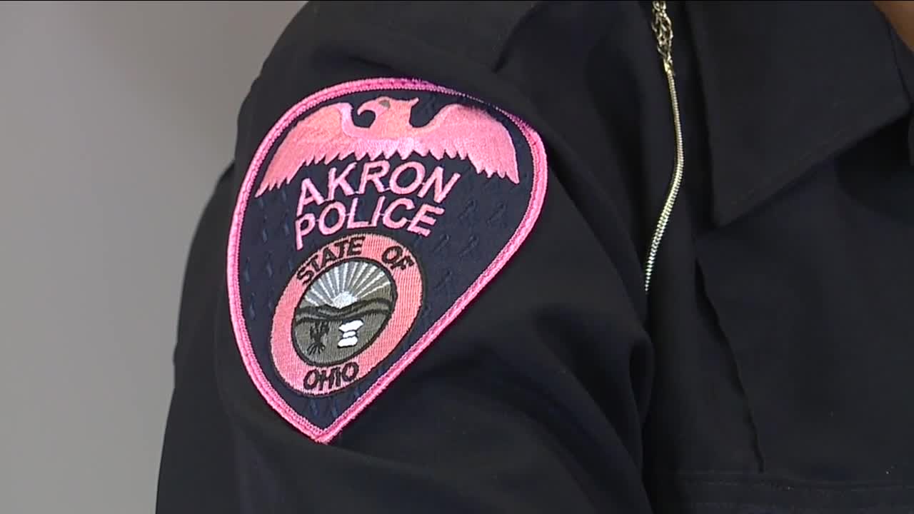 Akron police officers wearing pink patches for breast cancer awareness ...