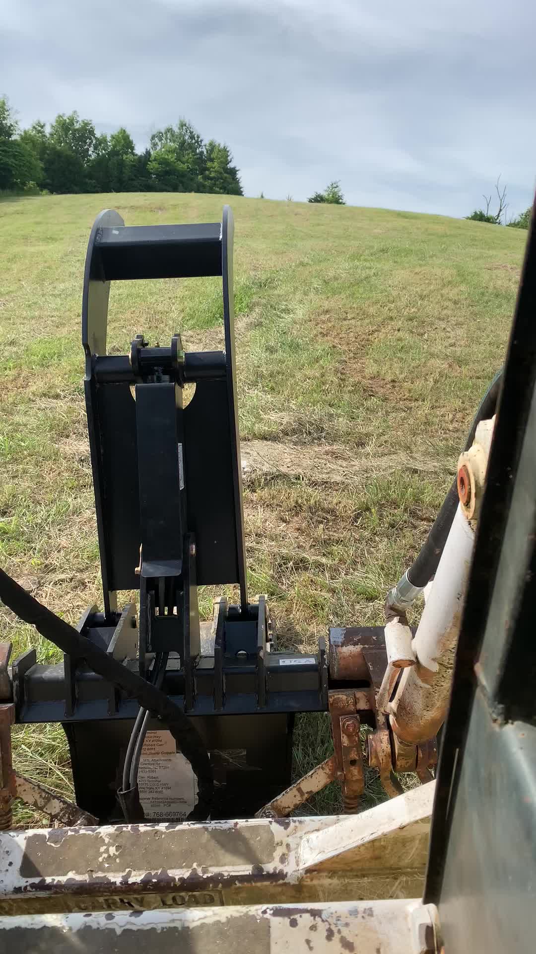 Worlds Largest Wheeled skid steer picking car sized rocks out of the field!