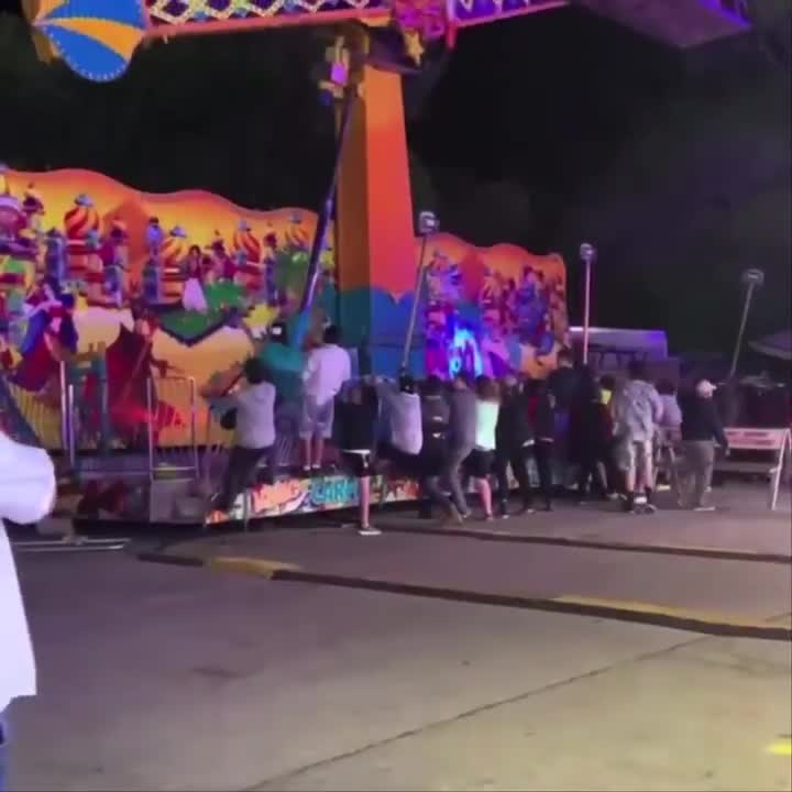 Carnival ride malfunctions, people run to prevent it from tipping over