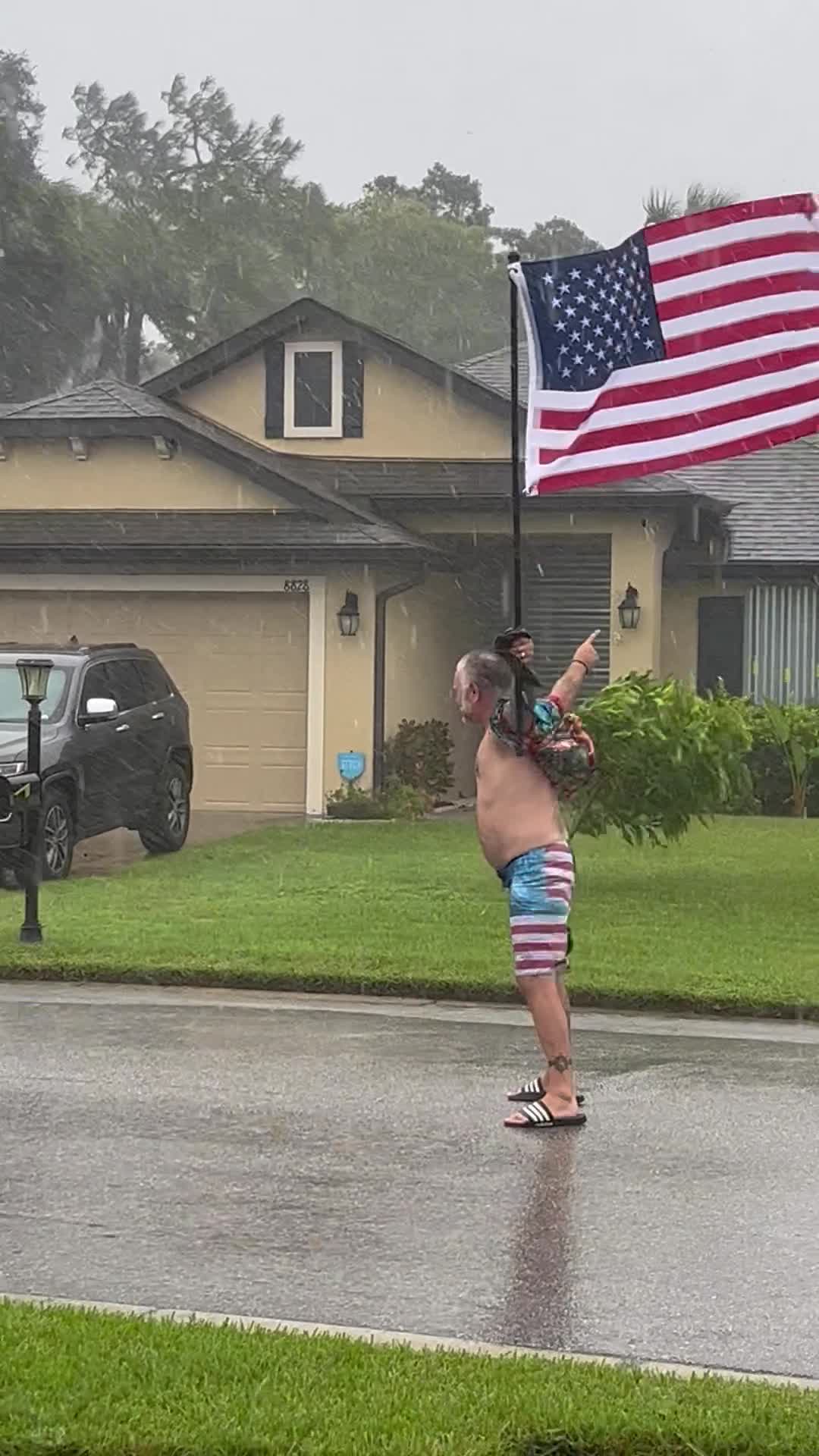 Hurricane Ian Welcomed by Man Waving America Flag