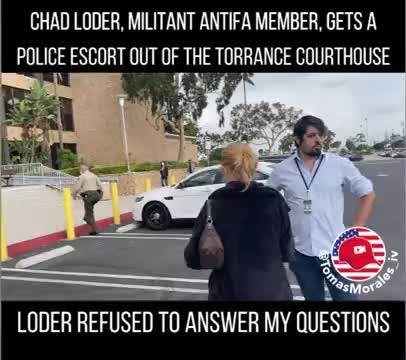 Antifa member Chad Loder leaves court in a Mercedes with a police escort