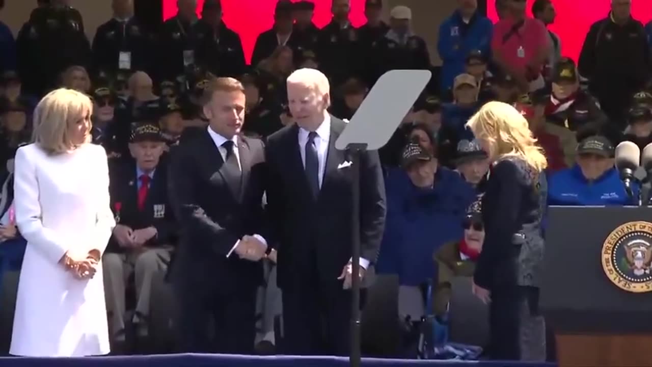 At a D-Day anniversary event, President Biden tries to sit on the toilet