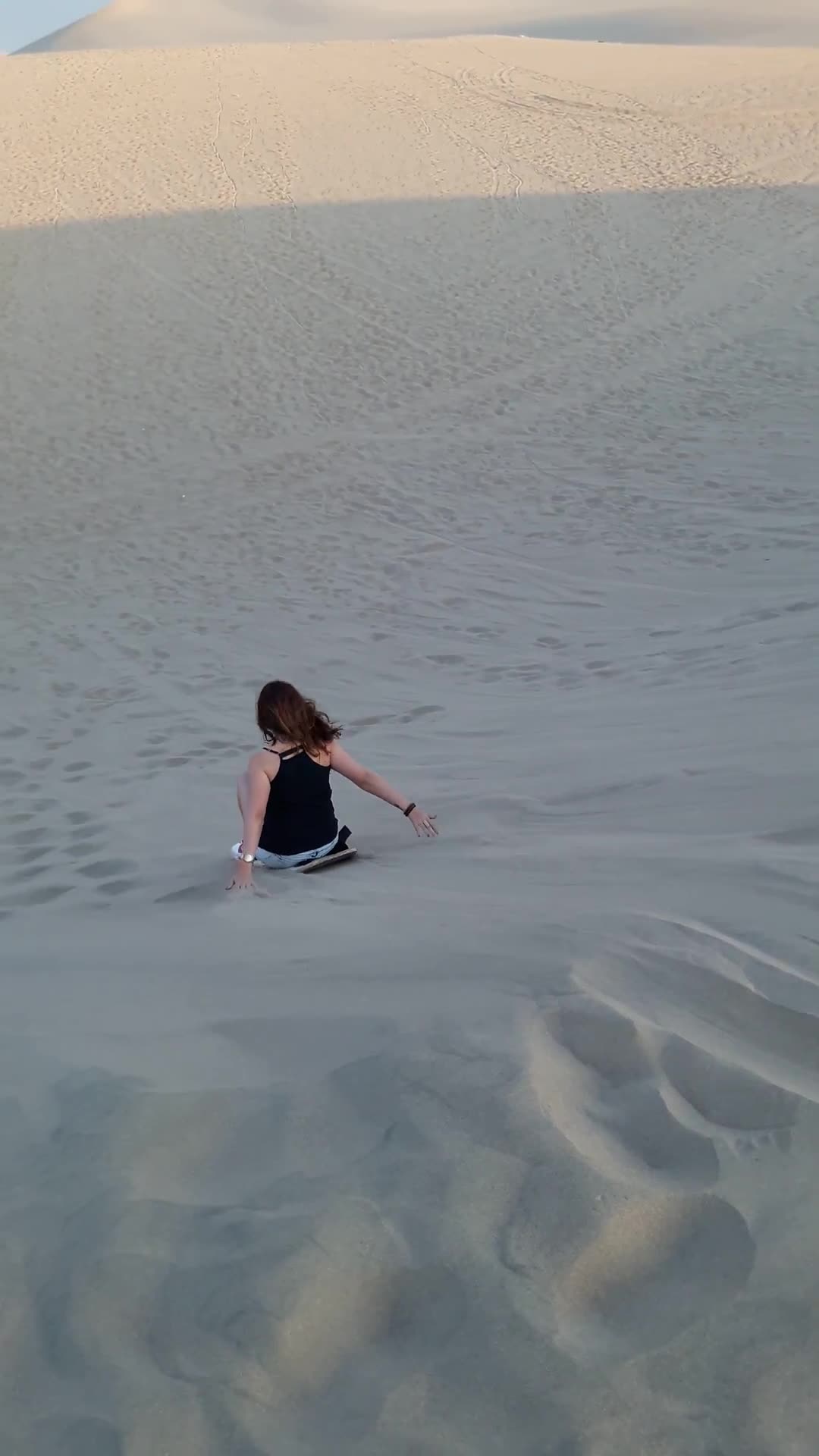 Sand boarding down the hill!