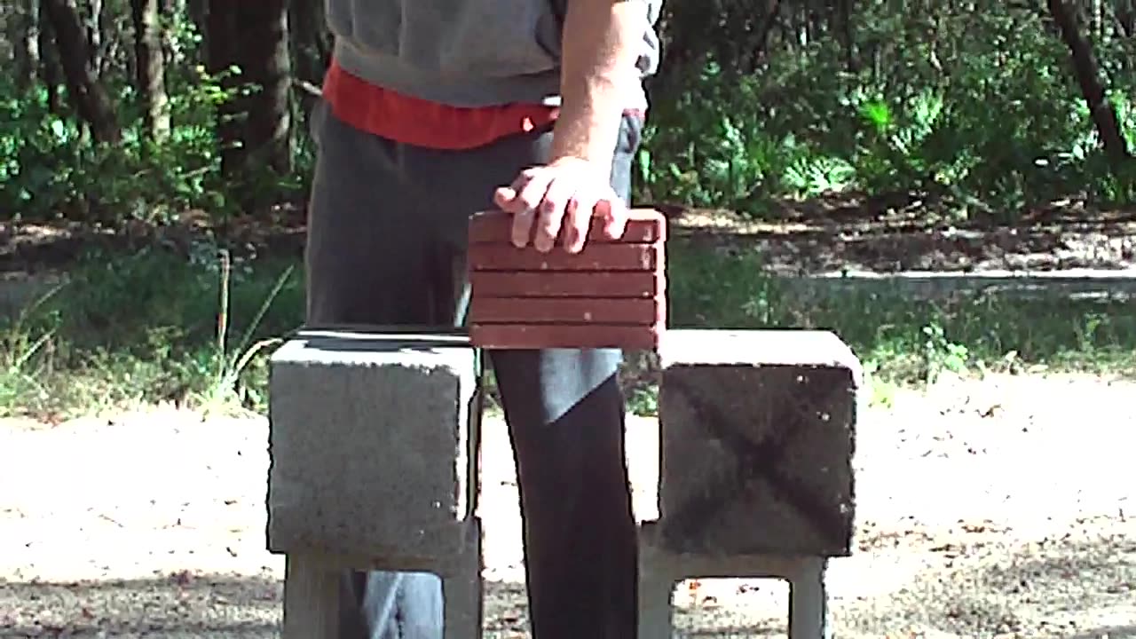 Breaking Just The Bottom Brick Of A Stack Of 5 Bricks With A Palm ...
