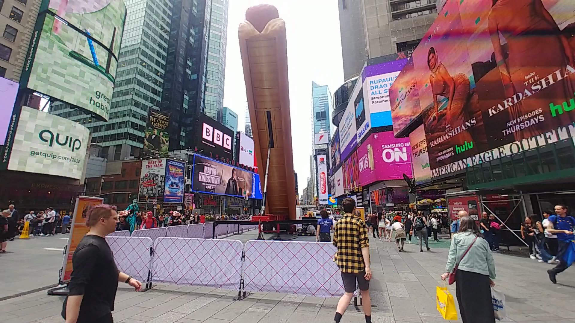 The Giant Hot Dog art in Times Square featuring former Congressman ...