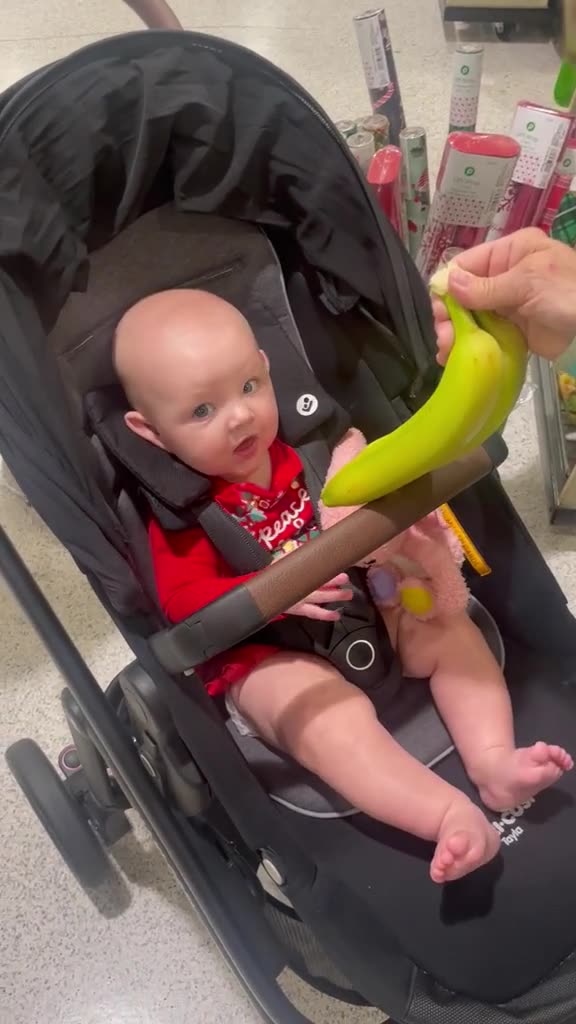 Adorable Baby's First Encounter with Bananas in a Superstore